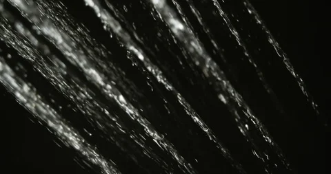 Falling water drops in 4K on black | Stock Video | Pond5