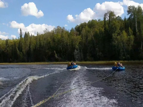 Falling off while Tubing Behind Speed Bo... | Stock Video | Pond5
