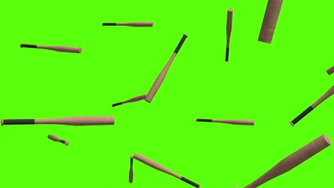 Falling wodeen baseball bats over green ... | Stock Video | Pond5