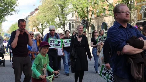 Families march with Stop Ecocide-signs i... | Stock Video | Pond5