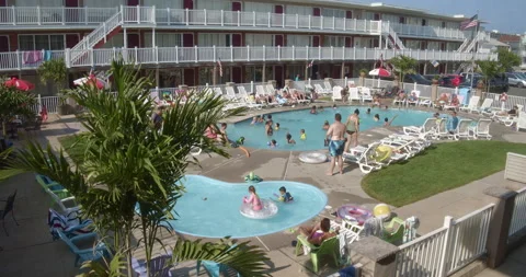 Families Swim In The Pool At Vintage Mot... | Stock Video | Pond5