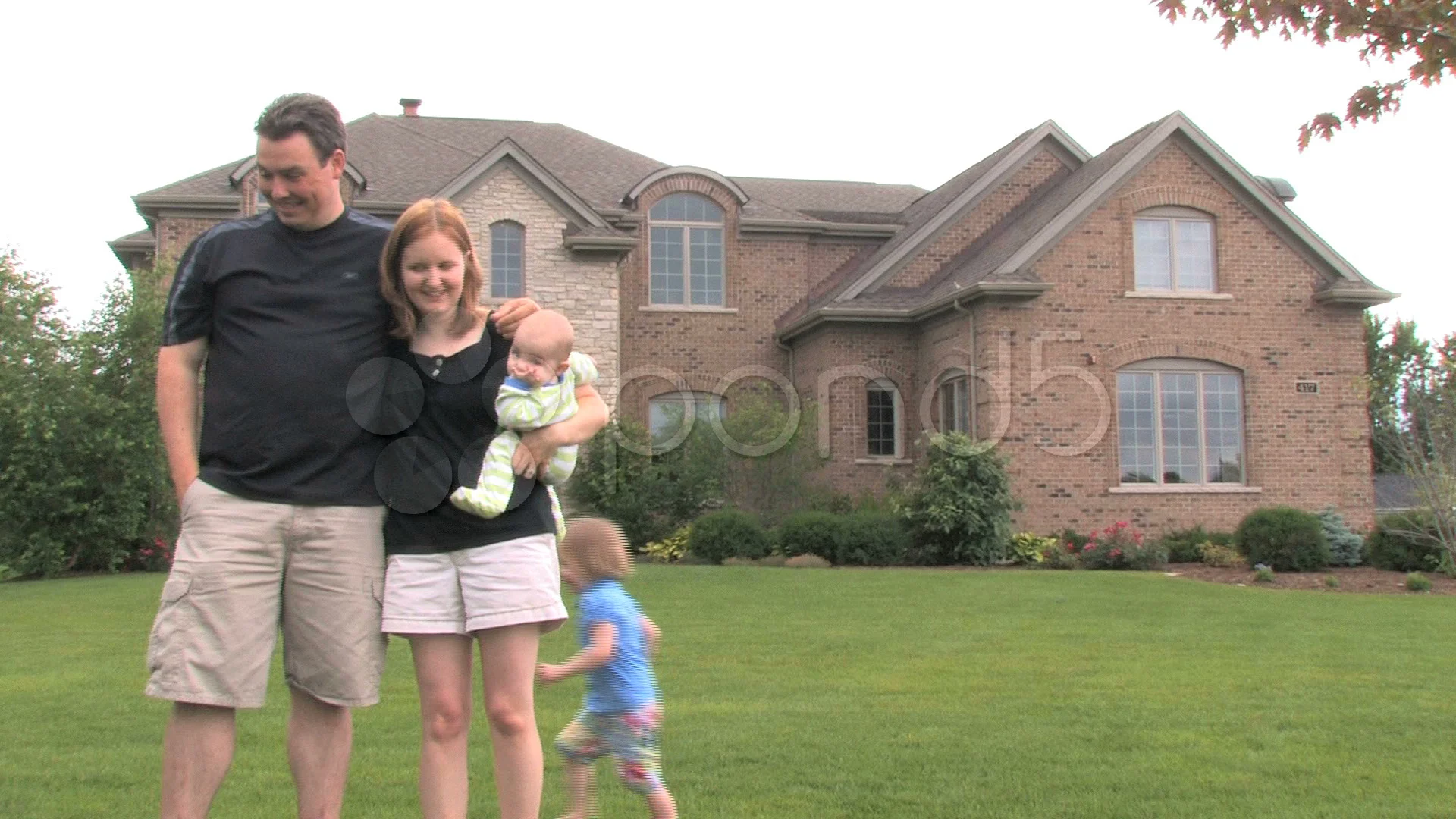 Rich Family In Front Of House