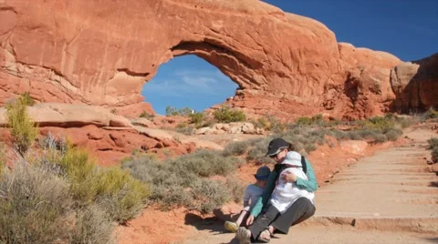 Family at an arch in Arches National Par... | Stock Video | Pond5