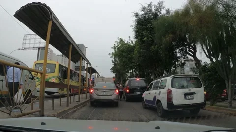 a family asking for help at a traffic li... | Stock Video | Pond5