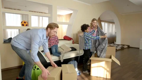 Family with children moving in. | Stock Video | Pond5
