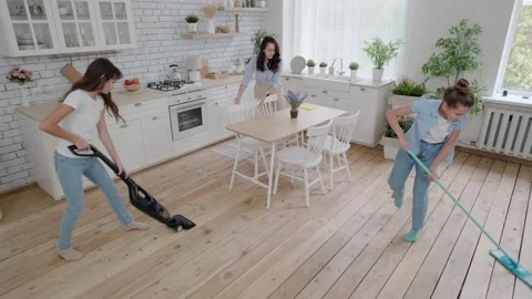 Family is cleaning up the house. The dau... | Stock Video | Pond5