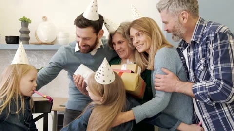 Family congaratulate grandmother with ha... | Stock Video | Pond5