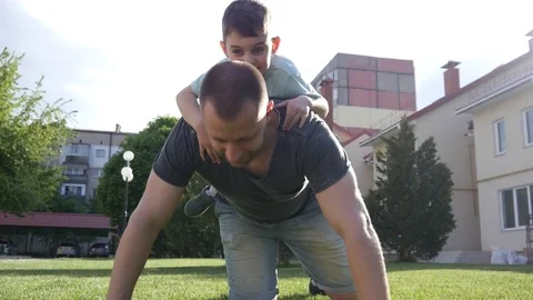 Family fun on backyard, father push-ups ... | Stock Video | Pond5