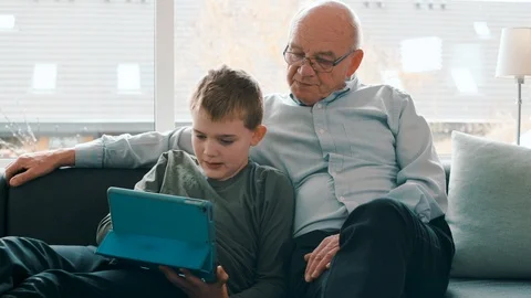 Family generations together around techn... | Stock Video | Pond5