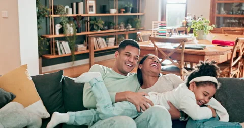 Family, hug and laughing on a sofa at ho... | Stock Video | Pond5