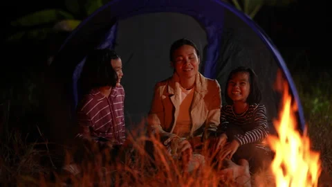 Family mother and children on fire camp ... | Stock Video | Pond5