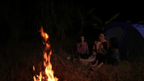 Family mother and children on fire camp ... | Stock Video | Pond5