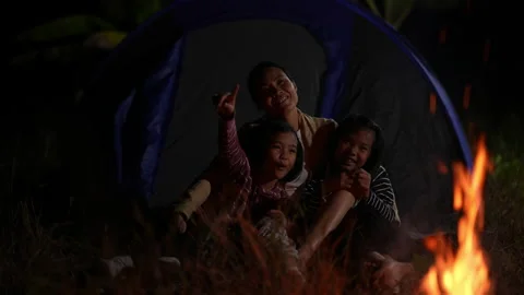 Family mother and children on fire camp ... | Stock Video | Pond5