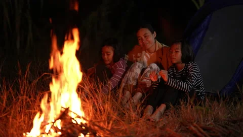 Family mother and children on fire camp ... | Stock Video | Pond5