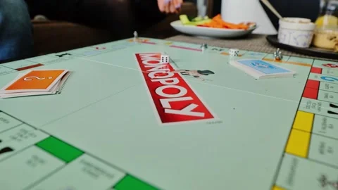 Family Playing Monopoly Board Game Indoo... | Stock Video | Pond5