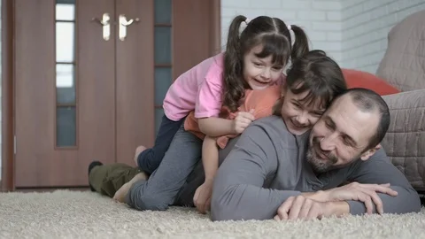 Family pyramid. Children are lying on da... | Stock Video | Pond5