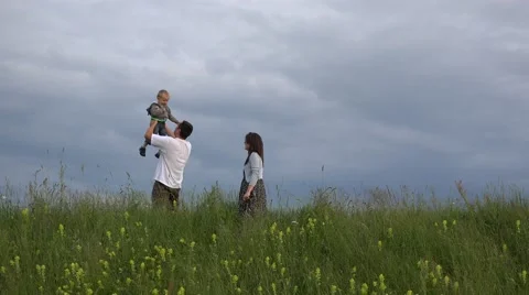 Family spring scenery, father rise up ch... | Stock Video | Pond5