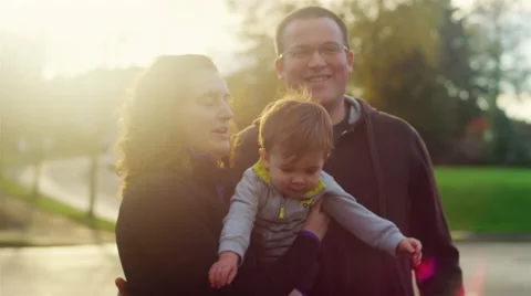 Family of three posing for a photo, litt... | Stock Video | Pond5