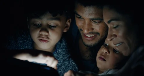 family using tablet computer at night ki... | Stock Video | Pond5