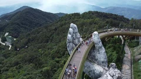 Famous bridge held by giant hands in Ba ... | Stock Video | Pond5