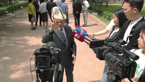 A famous old man gives an interview to t... | Stock Video | Pond5