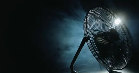 Fan blades rotate in rays of light and f... | Stock Video | Pond5
