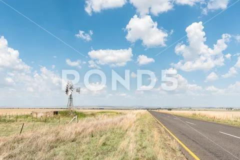 Farm scene with water-pumping windmill between Verkeerdevlei and ...