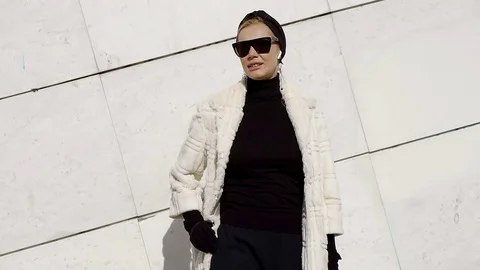 fashion model is standing in background ... | Stock Video | Pond5
