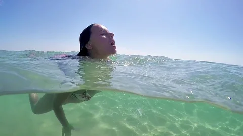 Fashion model swimming underwater go to ... | Stock Video | Pond5