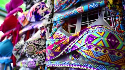 fashioned bikini sels on night market in... | Stock Video | Pond5