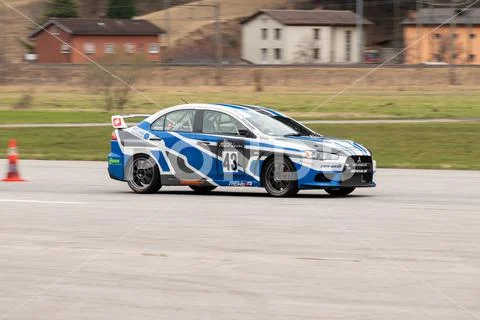 Fast car during a test race on the local airfield in Ambri in ...