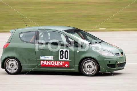 Fast car during a test race on the local airfield in Ambri in ...