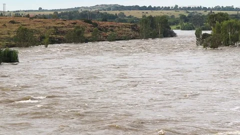 Fast flowing river flooding downstream, ... | Stock Video | Pond5
