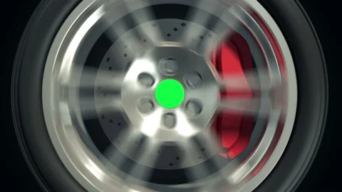 Fast spinning car wheel with green scree... | Stock Video | Pond5