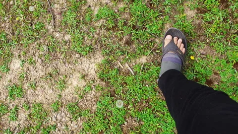Fast walking steps of man on soil. Foot ... | Stock Video | Pond5