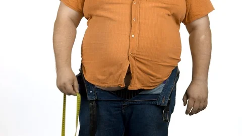Fat man check his body with a measuring ... | Stock Video | Pond5