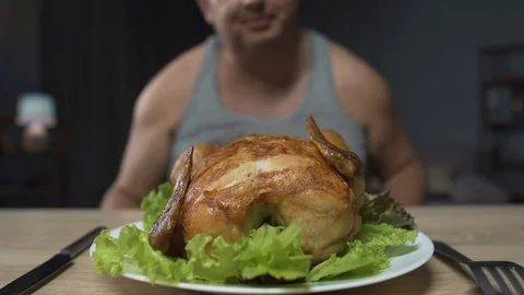 Fat man preparing to eat greasy fried ch... | Stock Video | Pond5