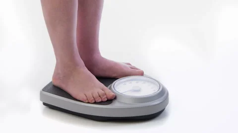 fat man on scale | Stock Video | Pond5