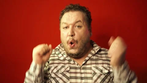 Fat man swearing and crying. Red backgro... | Stock Video | Pond5