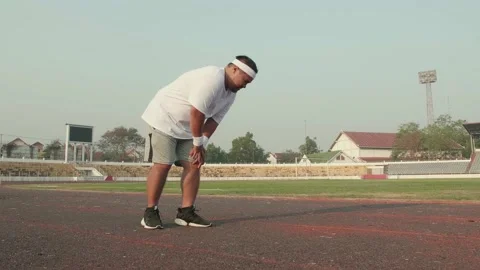 Fat Man Use Hands Hold On His Knee While... | Stock Video | Pond5