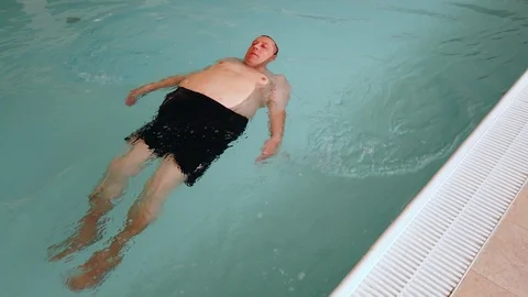 Fat overweight man floating in indoor ho... | Stock Video | Pond5