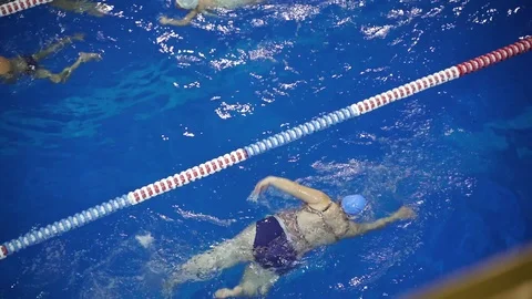 Fat woman swims in the swimming pool | Stock Video | Pond5