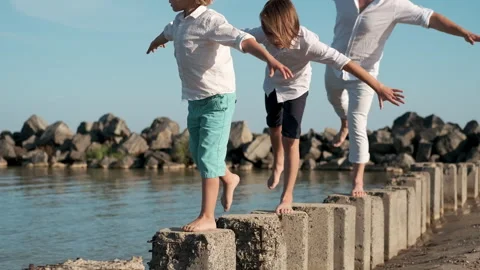 Father and children stand on one leg and... | Stock Video | Pond5