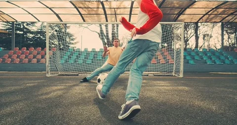 Father and Son play football on stadium,... | Stock Video | Pond5
