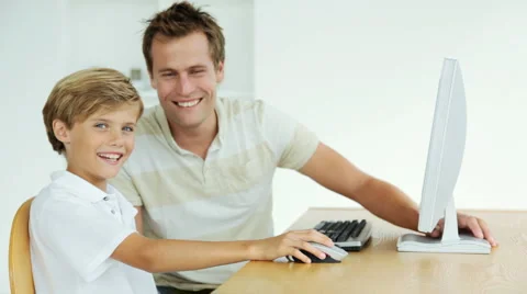 Father and Son working on the Computer a... | Stock Video | Pond5