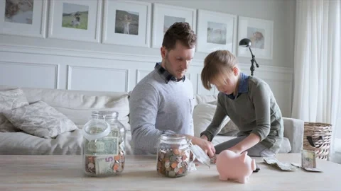 Father helping daughter counting allowan... | Stock Video | Pond5