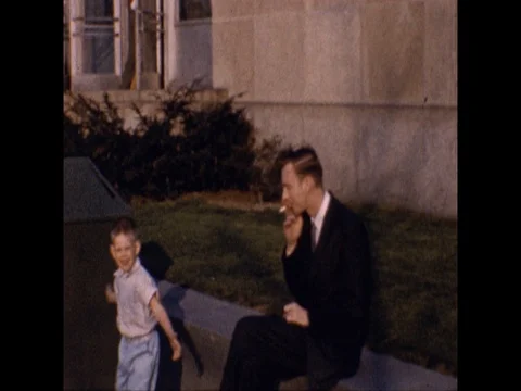 Father with little boy smoking a cigaret... | Stock Video | Pond5