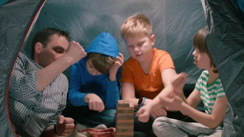 Father with many children plays with the... | Stock Video | Pond5