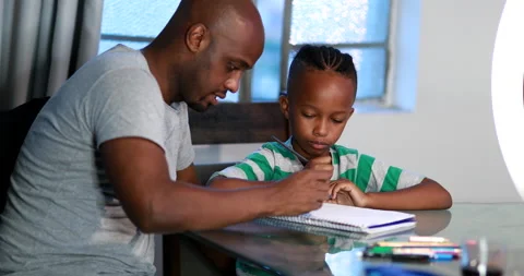 Father mentoring son, dad helping kid wi... | Stock Video | Pond5