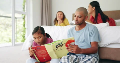 Father reading books to child in bedroom... | Stock Video | Pond5
